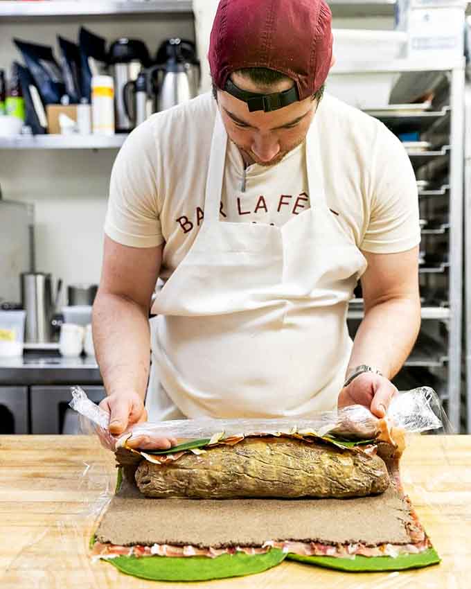 Behind the scenes, skilled hands craft dishes with the precision that separates good food from unforgettable.