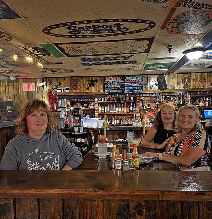 Happy diners at the bar prove good food and warm atmosphere create the perfect recipe for memorable meals together.