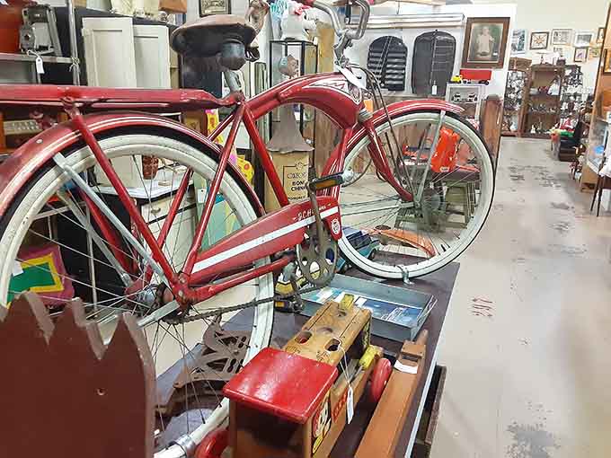 A classic red bicycle that's seen more miles than your current car and looks better doing it.