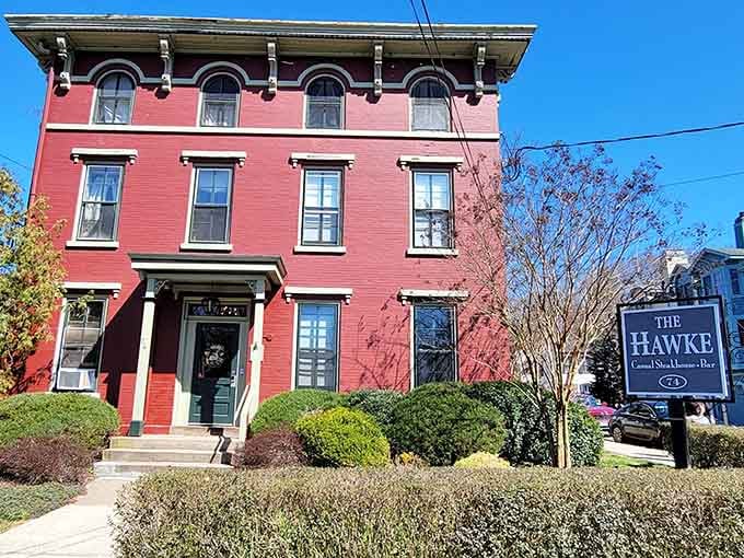The Hawke's bold red facade commands attention like a Victorian lady in her finest dress, elegant and unapologetically eye-catching.