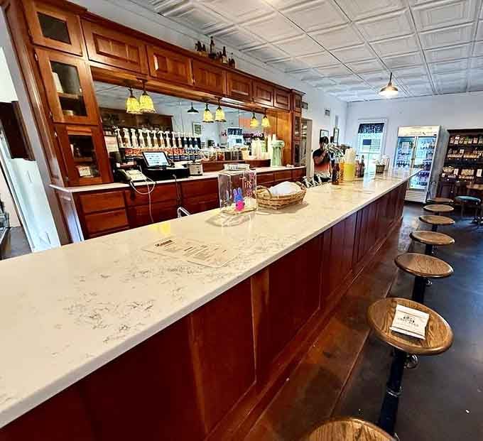 The polished wooden counter with bar stools offers front-row seats to small-town Texas hospitality at its finest.