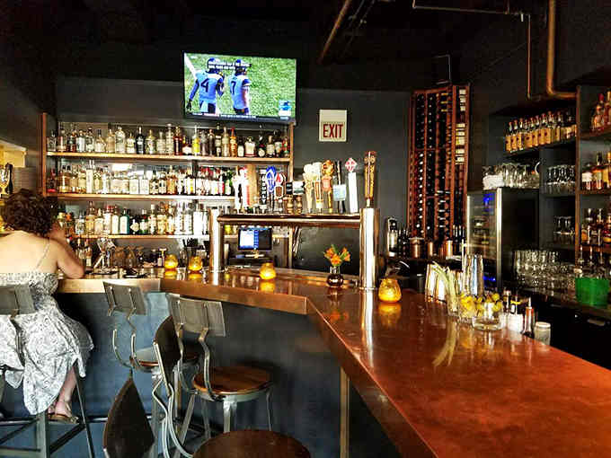 The bar area invites you to settle in, order something strong, and let the evening unfold naturally around you.