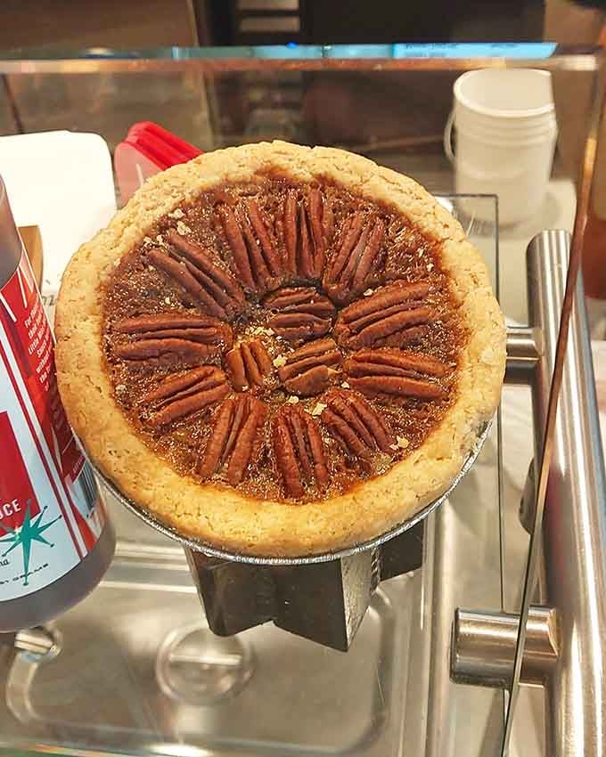 Pecan pie arranged like a sunburst reminds you that dessert is always worth saving room for somehow.