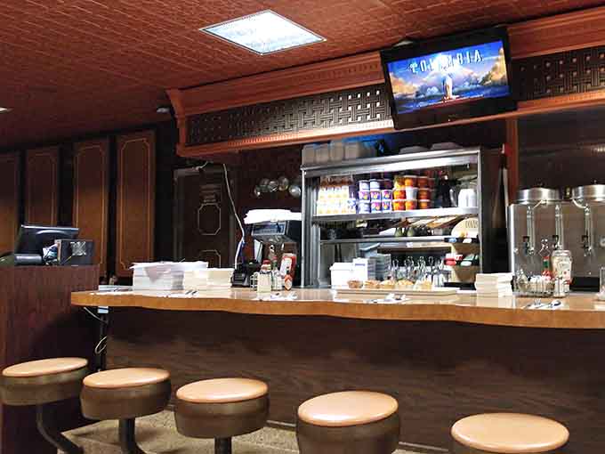 Counter seating where solo diners become regulars and strangers become friends over refills and conversation.