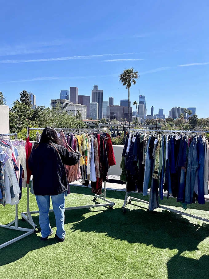 The LA skyline watches over racks of vintage clothing like a proud parent at a very stylish recital.