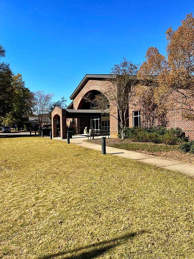 The library's brick arches frame a building that respects both books and the people who love them.
