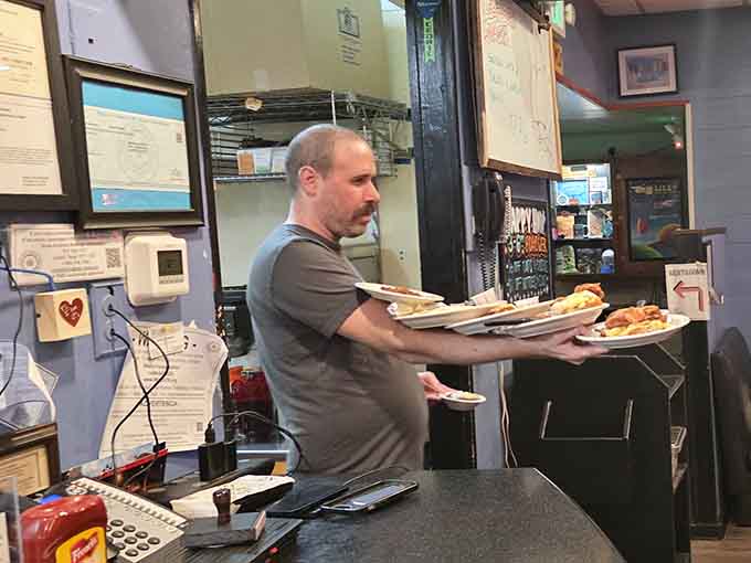 Plates loaded and ready to go: the staff here moves with the practiced efficiency of people who've mastered the breakfast rush.