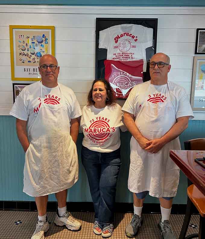 The team behind the tomato pies, wearing their years of service with pride and flour-dusted aprons with style.