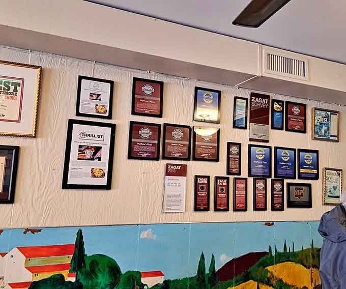 Those framed certificates aren't just decoration&mdash;they're proof that excellence gets recognized, even in pizza form.
