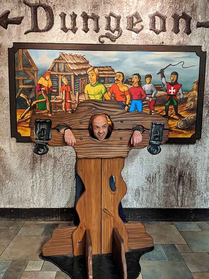 Stick your head in the dungeon stocks for a photo, because every castle visit needs proof of mischief.