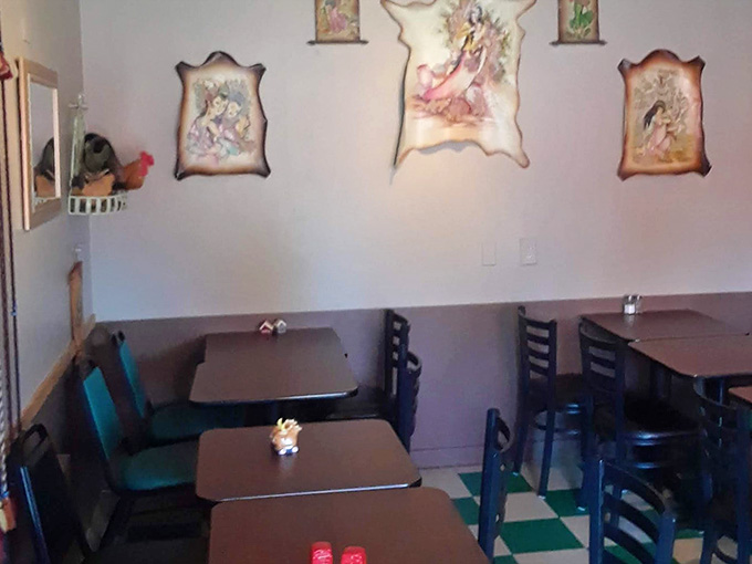 Charming interior details that make you feel right at home, from the artwork to the comfortable booth seating.