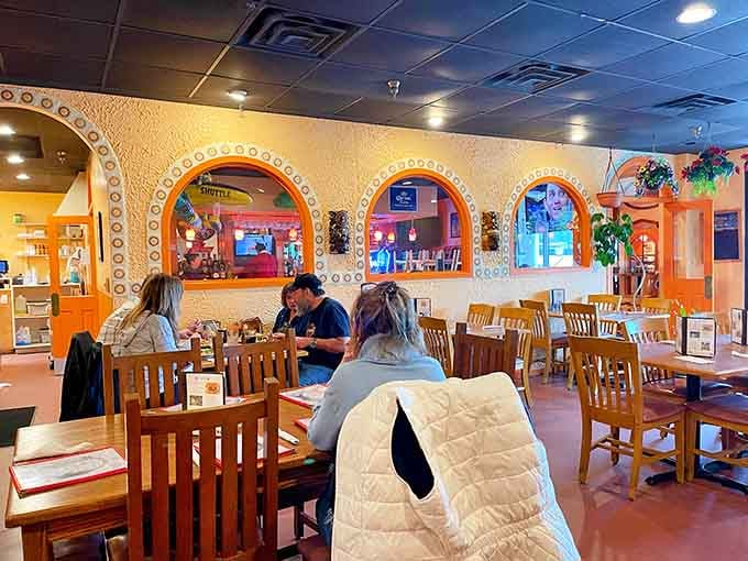 Comfortable seating and cheerful decor create the kind of atmosphere where stress melts faster than the cheese.