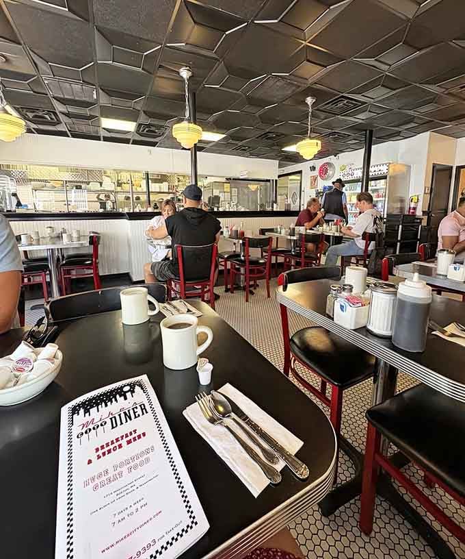 The dining room buzzes with that perfect energy that only happens when good food brings people together.