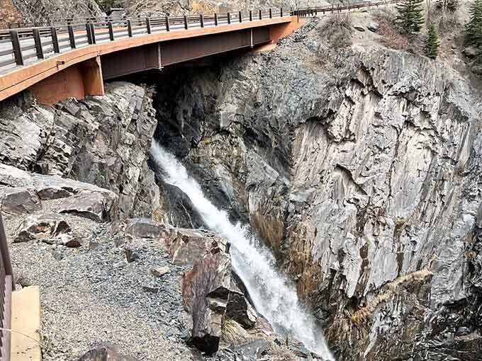 Waterfalls plunge beneath bridges, adding dramatic sound effects to your already cinematic mountain drive through the San Juans.
