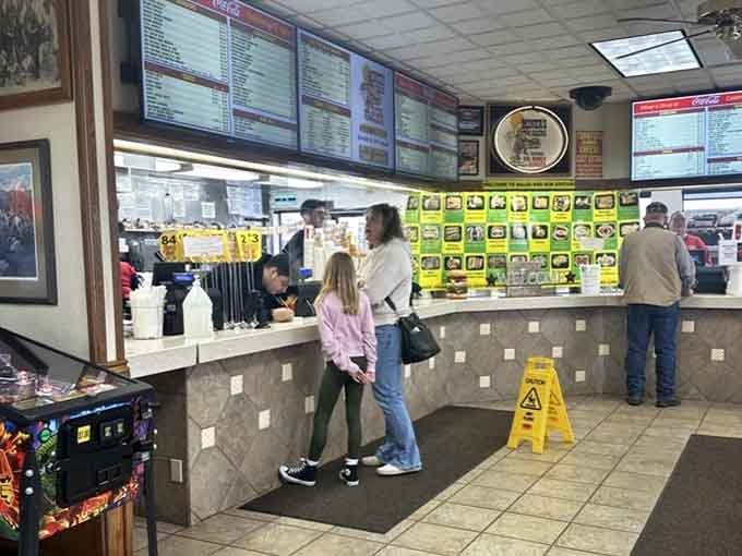 The ordering counter where dreams are placed and stomachs prepare themselves for glorious defeat.