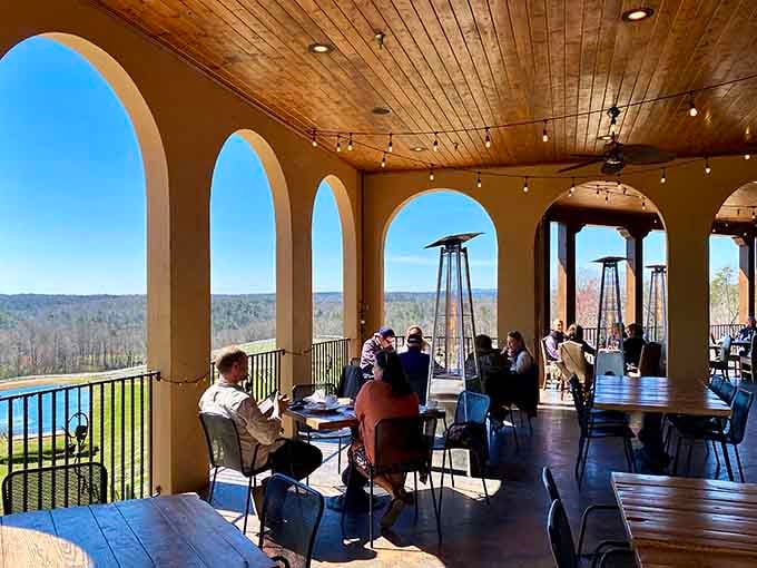Arched windows framing mountain views so stunning they compete with your pasta for attention, and sometimes they actually win.
