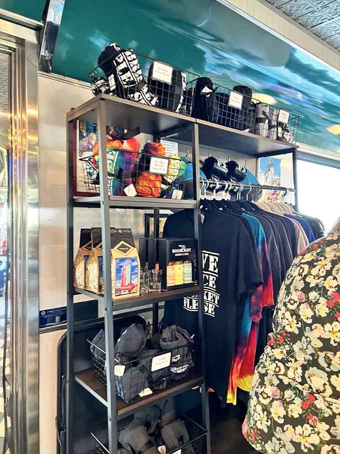 Even the merchandise display has that retro charm, because why shouldn't your wardrobe match your favorite diner's aesthetic?