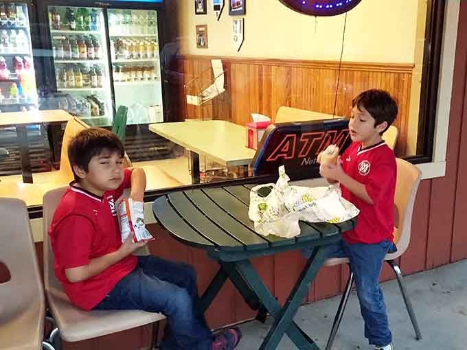 Young diners discovering that the best restaurants don't always need fancy decorations to create lasting memories.