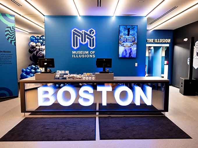 The welcoming admission area where your journey into perceptual chaos begins, complete with friendly staff and impossible geometry branding.