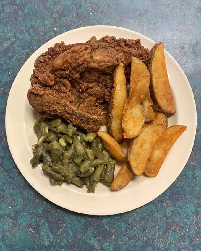 Fried chicken with steak fries and green beans, the holy trinity of comfort food done absolutely right.