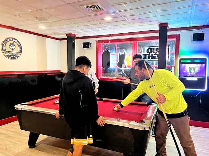 Pool sharks in action, proving that Nicky's Place is about the whole experience, not just the food.