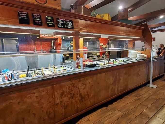 The buffet station stretches invitingly, a landscape of possibility where decisions become beautifully unnecessary and abundant.