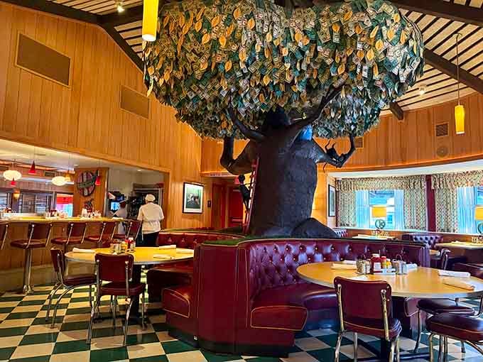 That whimsical money tree centerpiece adds charm while you wait for your order in cozy booth comfort.