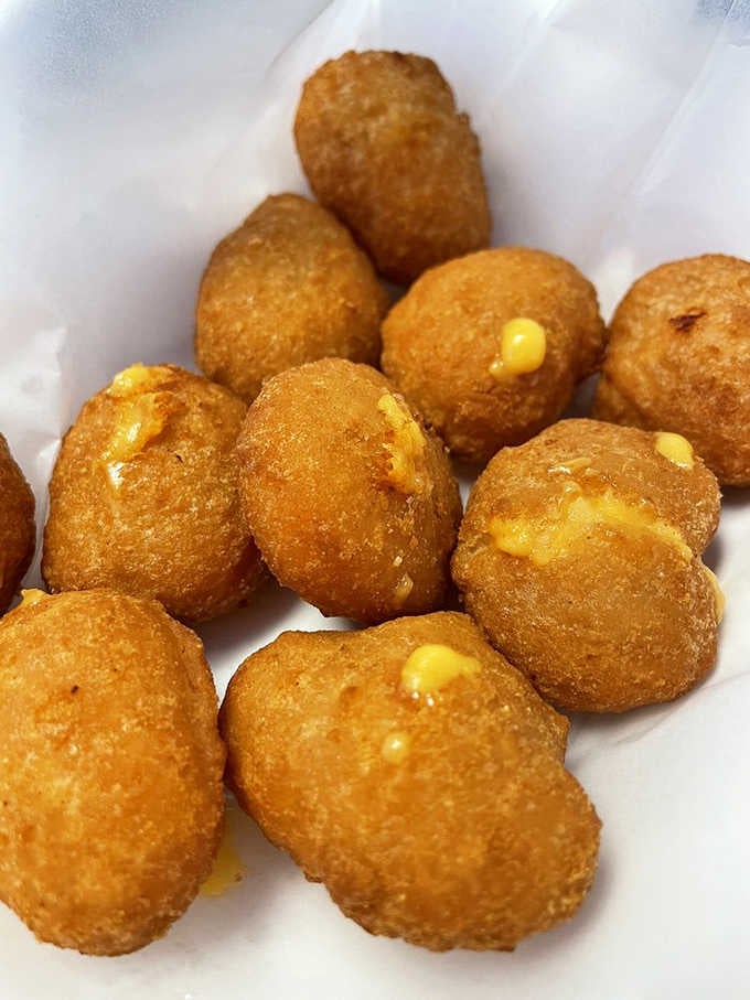 Mac and cheese balls that are crispy outside, creamy inside, like someone figured out how to improve comfort food perfection itself.