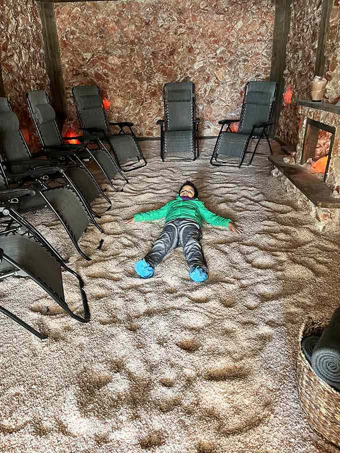 This kid's got the right idea, sprawling out on the salt floor like it's the world's most therapeutic beach.