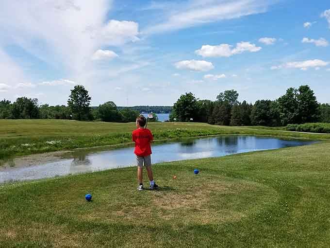 A young golfer practices at Saint Lawrence Park, where kids can still play outside without parental supervision committees.