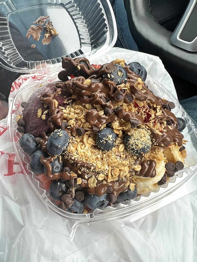 This acai bowl topped with granola and berries looks almost too beautiful to eat, but you'll manage somehow.