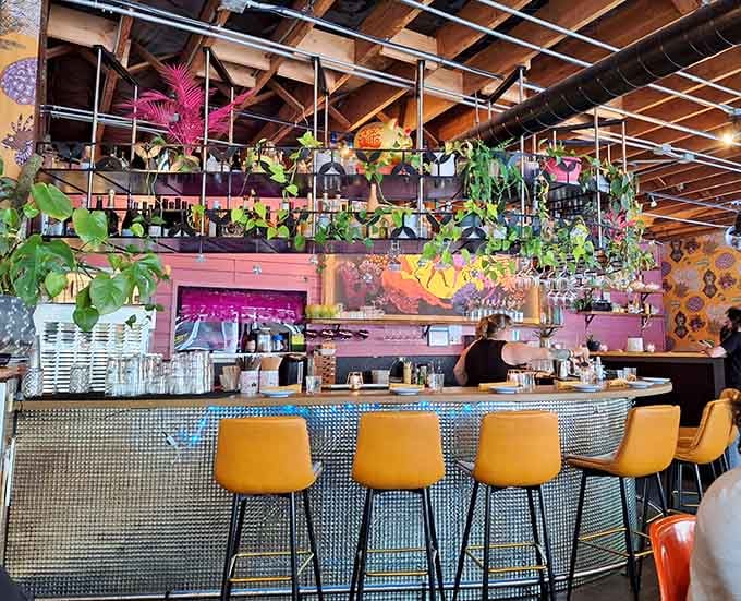 Bright yellow bar stools and disco ball tiles make waiting for your drink almost as fun as drinking it.