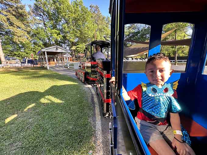 Young adventurers cruise the grounds in style, living their best cowboy life one train ride at a time.
