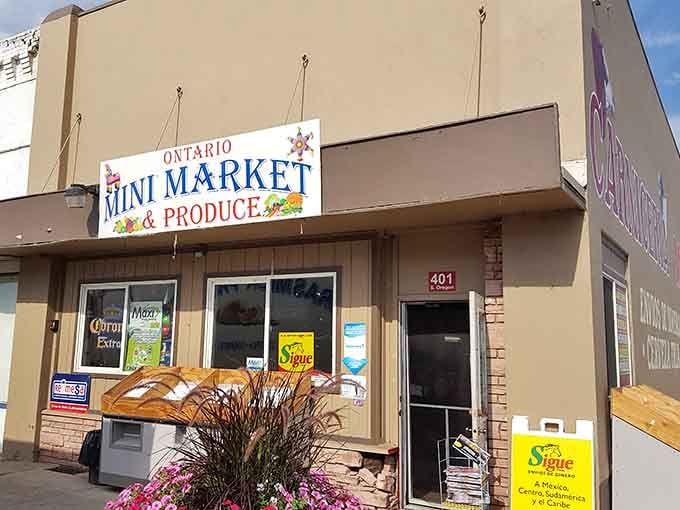 Fresh produce and local goods await behind cheerful signage, where shopping small means supporting neighbors who remember your name.