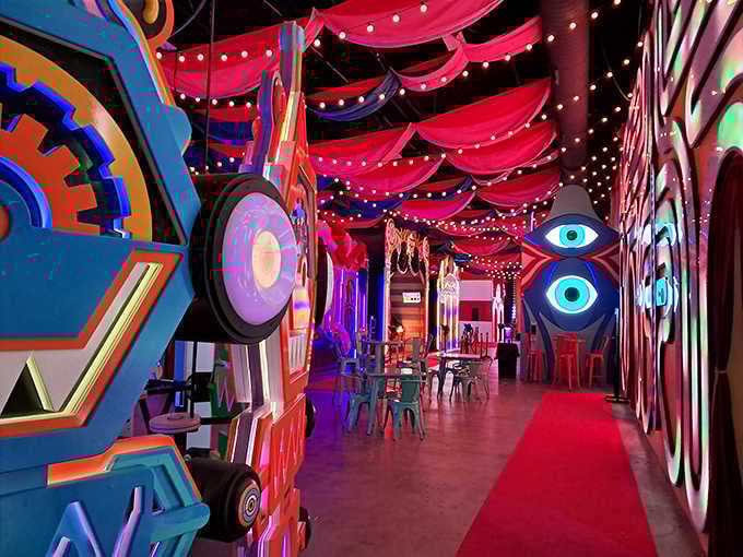 Red carpet treatment leads through a carnival of colors where every surface demands your attention.