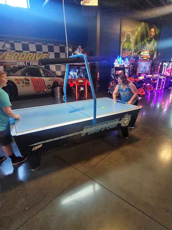 The arcade area provides entertainment for those waiting to race or recovering from defeat.