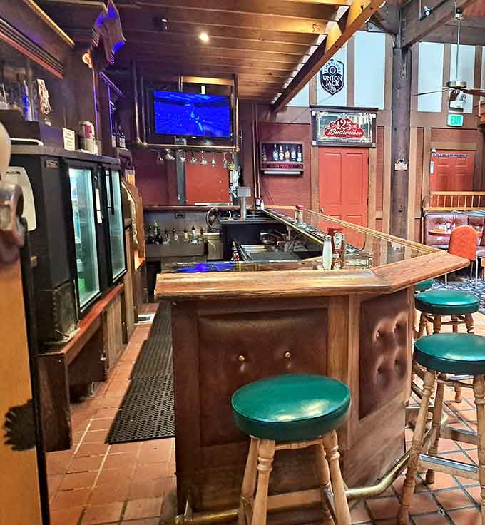 Even the bar area maintains that Danish village charm, complete with green stools and warm wood tones throughout.