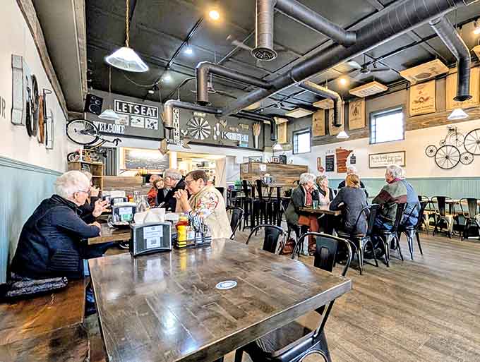 Real diners enjoying real meals in a real restaurant, not a staged photo shoot pretending people eat salads that enthusiastically.