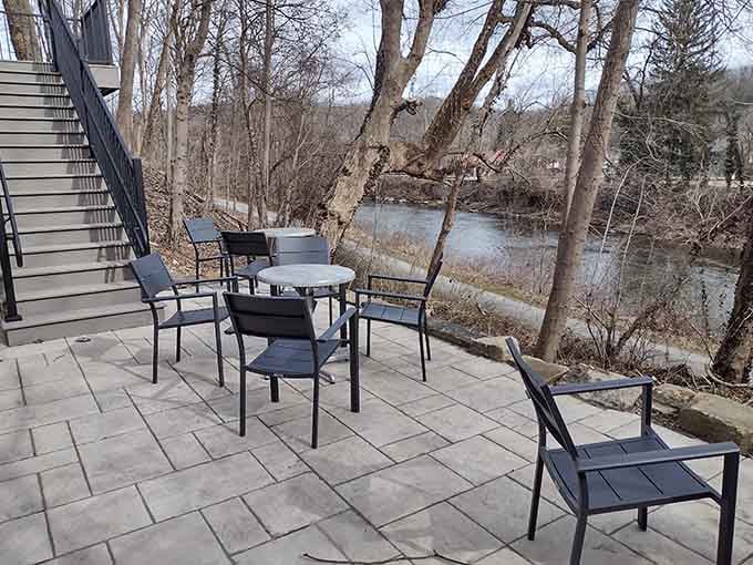 Riverside patio seating where nature provides the entertainment and coffee provides the fuel for pure contentment.