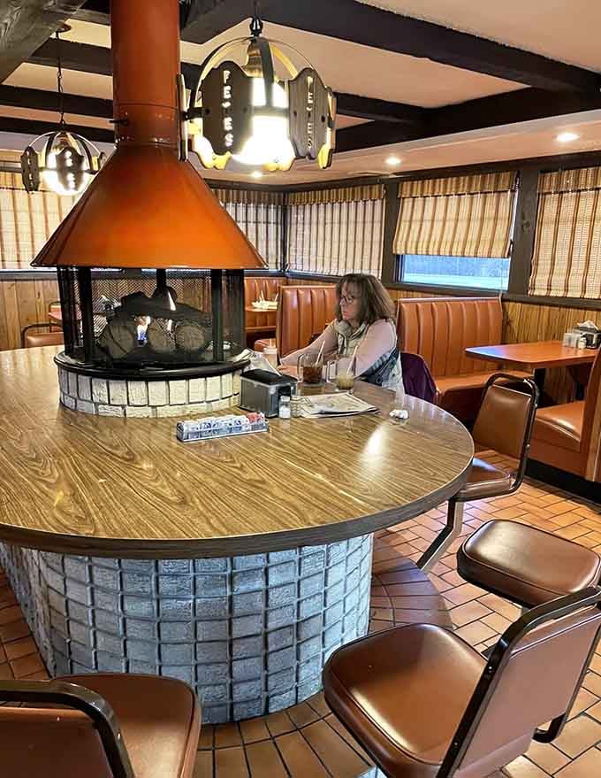 A customer enjoying the kind of peaceful meal that reminds us why we love these classic spots.