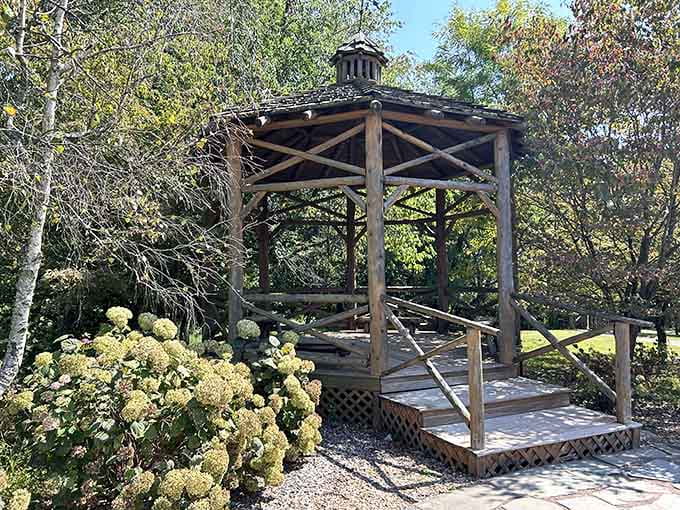 This rustic wooden gazebo offers shelter and charm, like something your crafty uncle might build on steroids.