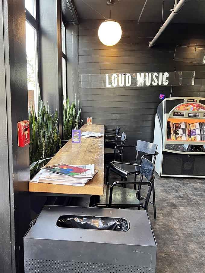 Window seating with a vintage jukebox nearby means you can watch the world go by while pretending you're in a movie.