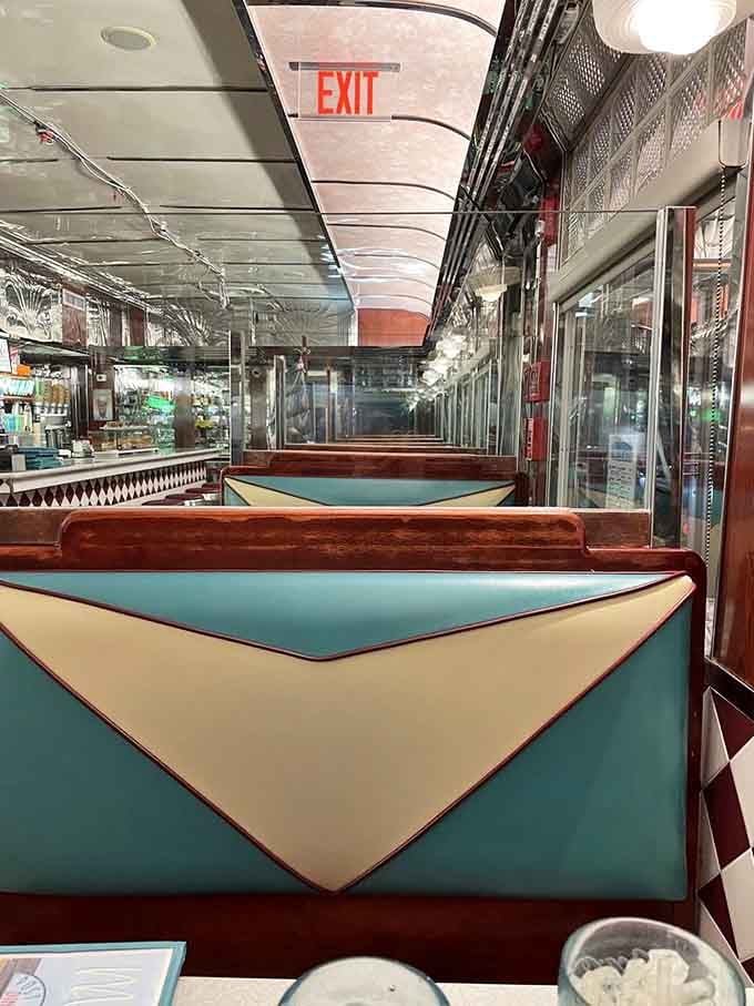 Turquoise and cream booths offer cozy seating where chrome accents reflect decades of satisfied diners and countless coffee refills.