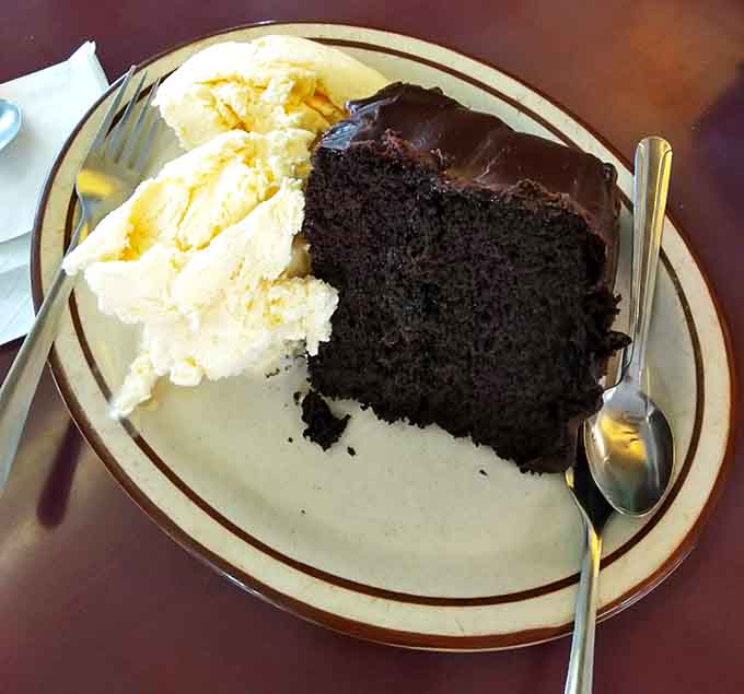 Chocolate cake with frosting this generous should probably require a permission slip, but thankfully it doesn't here.