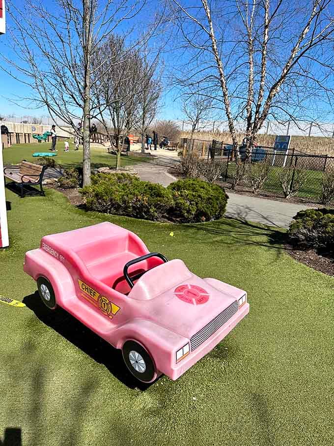 This pink ride-on car patrols the grounds, making every child feel like they're running the place.