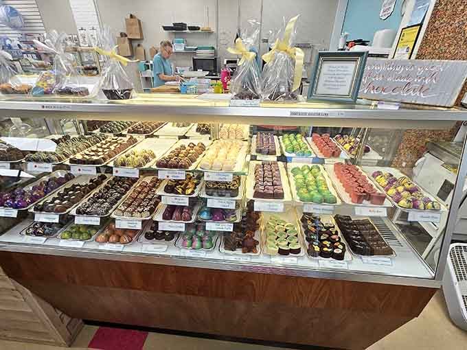 A pastry case bursting with colorful treats that would make Willy Wonka jealous of the sheer variety.