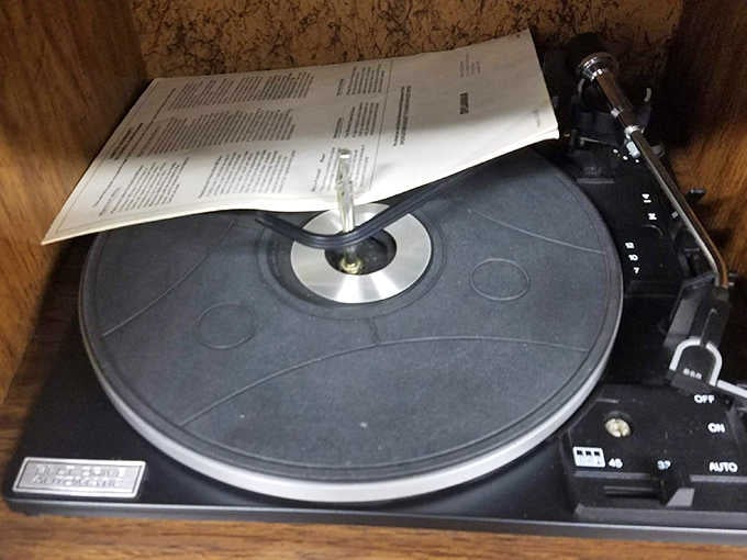 A classic turntable waits patiently for someone to appreciate vinyl the way it was meant to be heard.