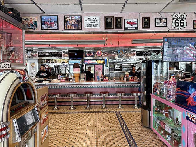 Classic diner counter with chrome stools that spin, because sitting still while waiting for food is overrated.
