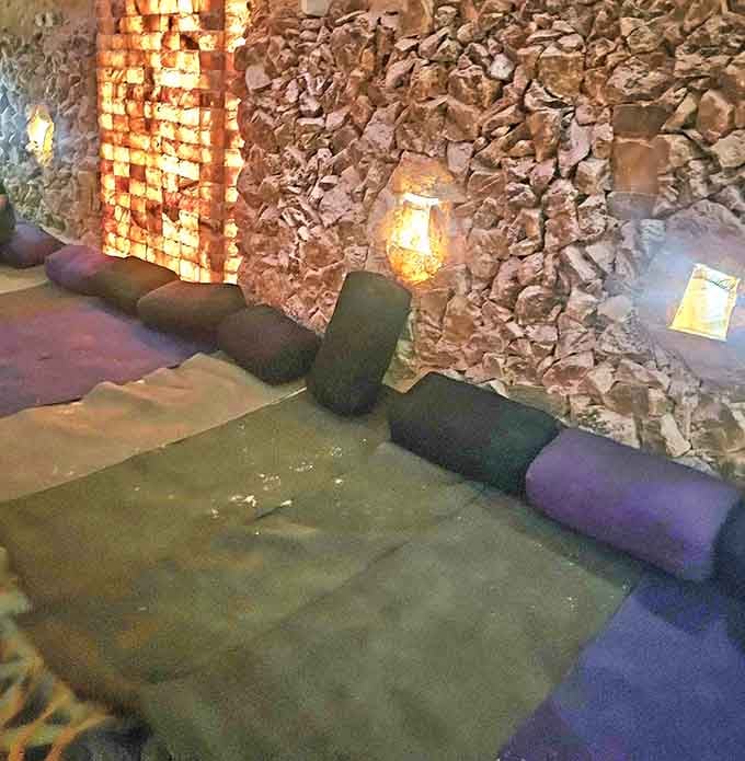 Meditation cushions arranged on the salt floor invite you to find your inner calm immediately.