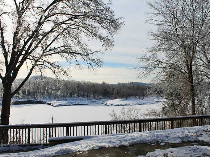 Winter transforms the lake into a serene snow globe scene, proving this park shines in every season beautifully.